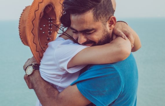 Discover the Secret Meaning of Over-the-Shoulder Hugs - Enrich Love